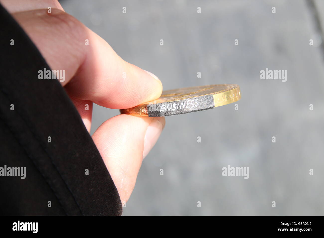 Gold coin hand hi-res stock photography and images - Alamy