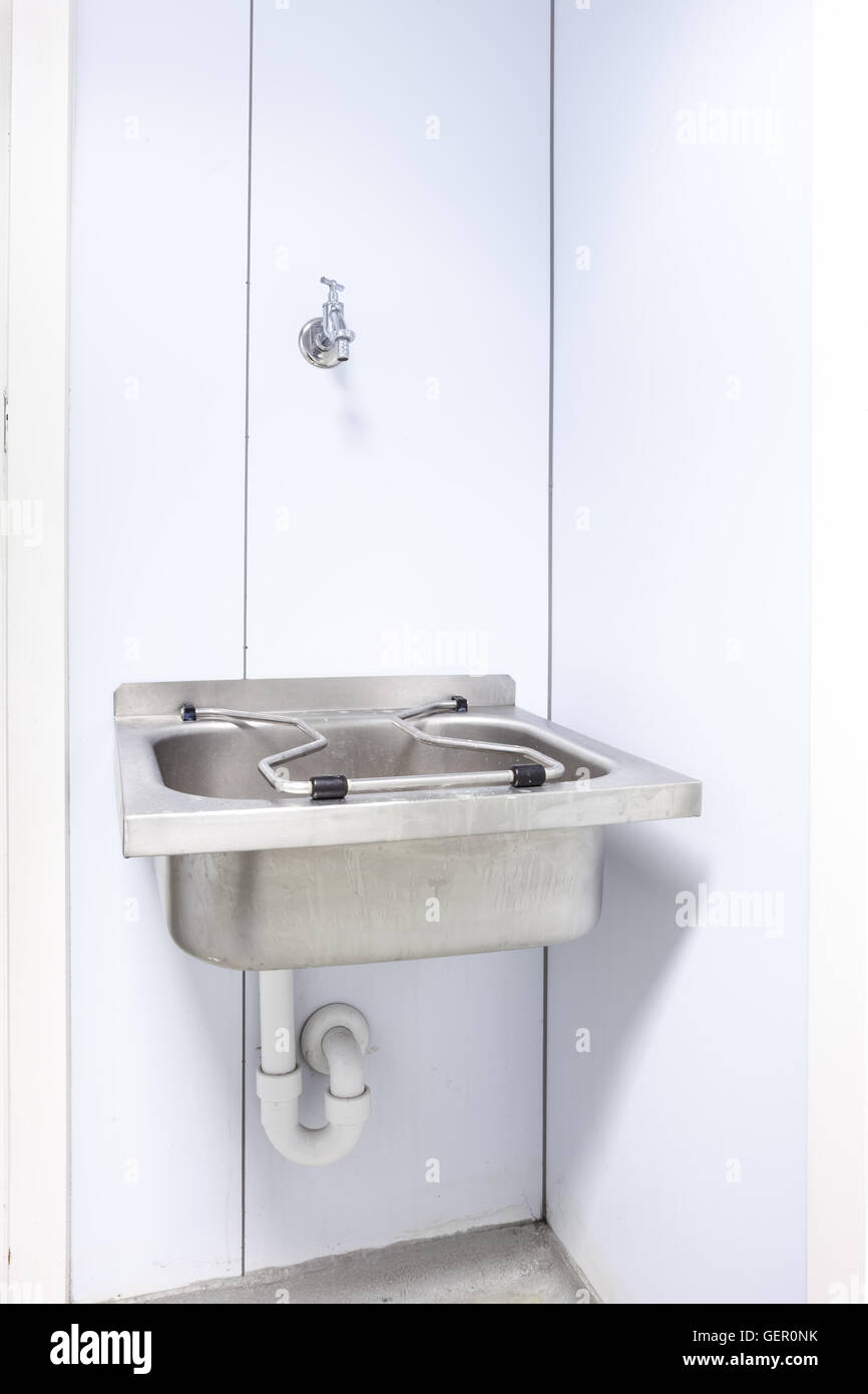 in an public restroom hangs on an wall of an inox sink Stock Photo - Alamy