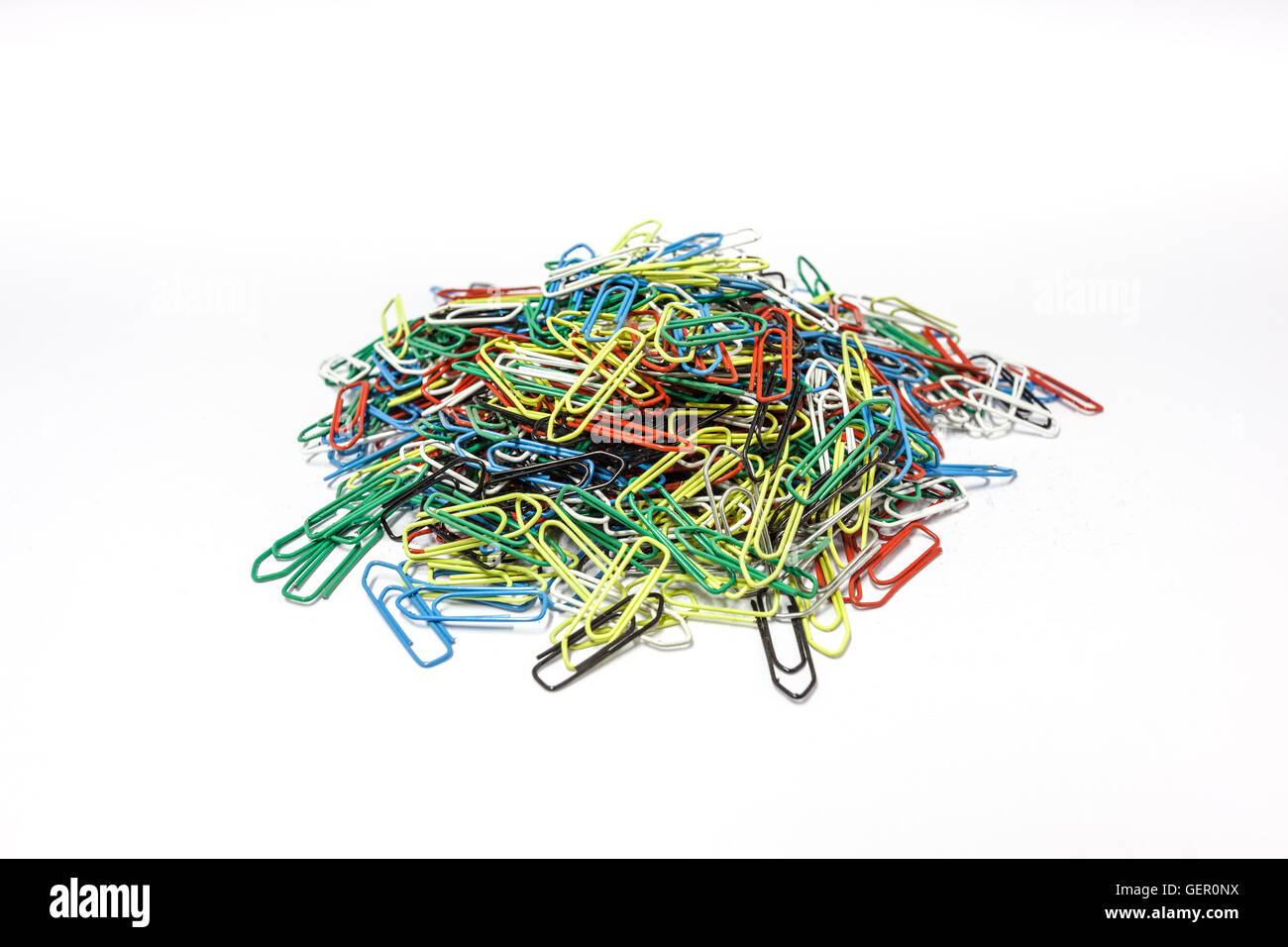 an stack of colored paper clips on a white surface Stock Photo - Alamy