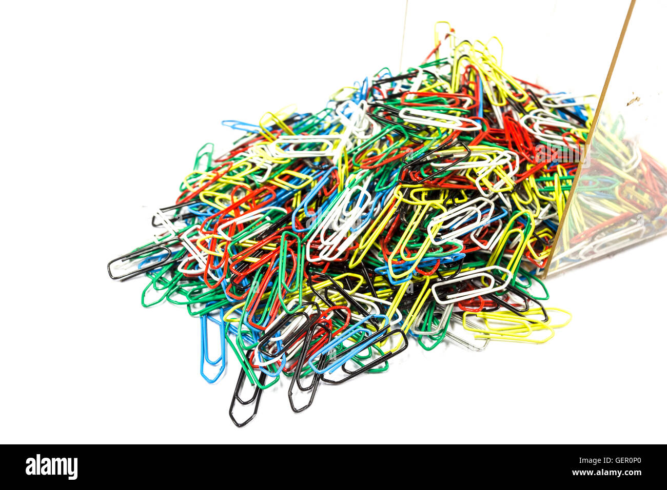 an stack of colored paper clips on a white surface Stock Photo - Alamy