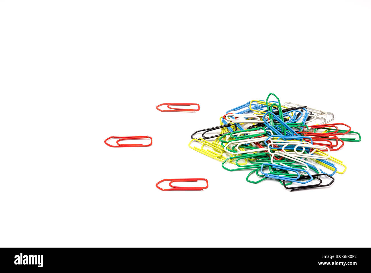 an stack of colored paper clips on a white surface Stock Photo - Alamy