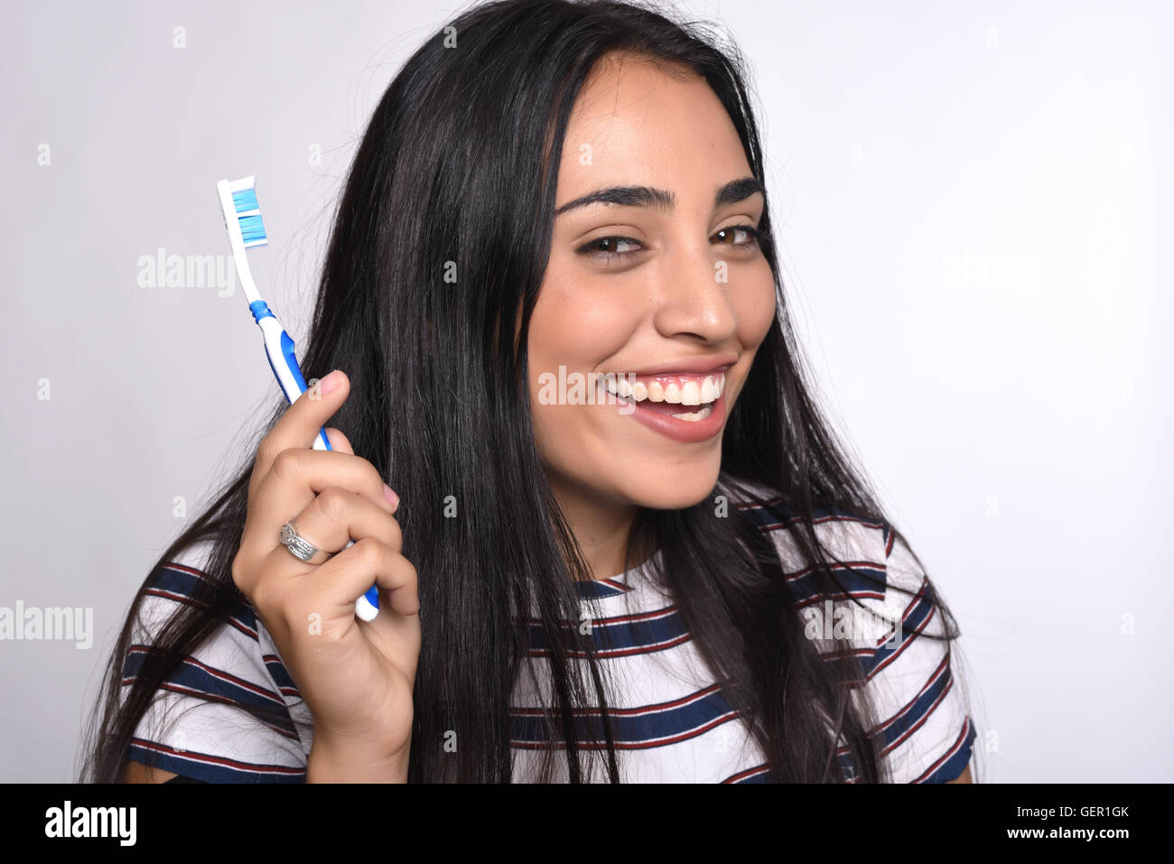Close-up woman brushing her teeth. Isolated white background Stock ...