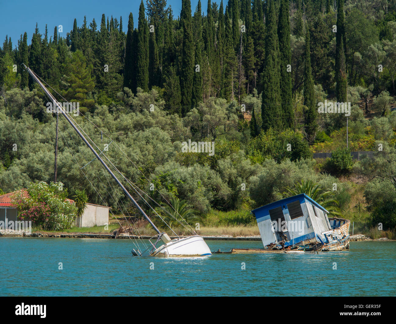 Sunken boats at sea Stock Photo - Alamy
