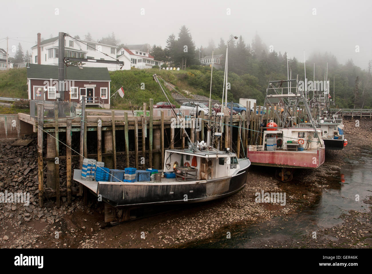 Fishing boats, tides out Stock Photo - Alamy