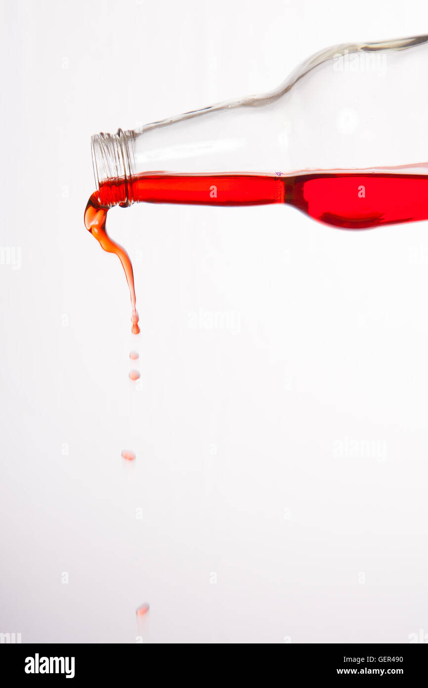 Bottle Pouring Red Liquid Stock Photo - Alamy