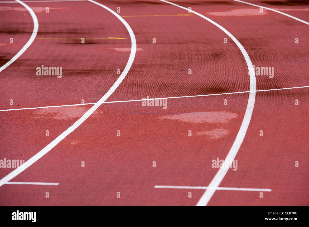 red running athletic track bad weather, wet Stock Photo - Alamy