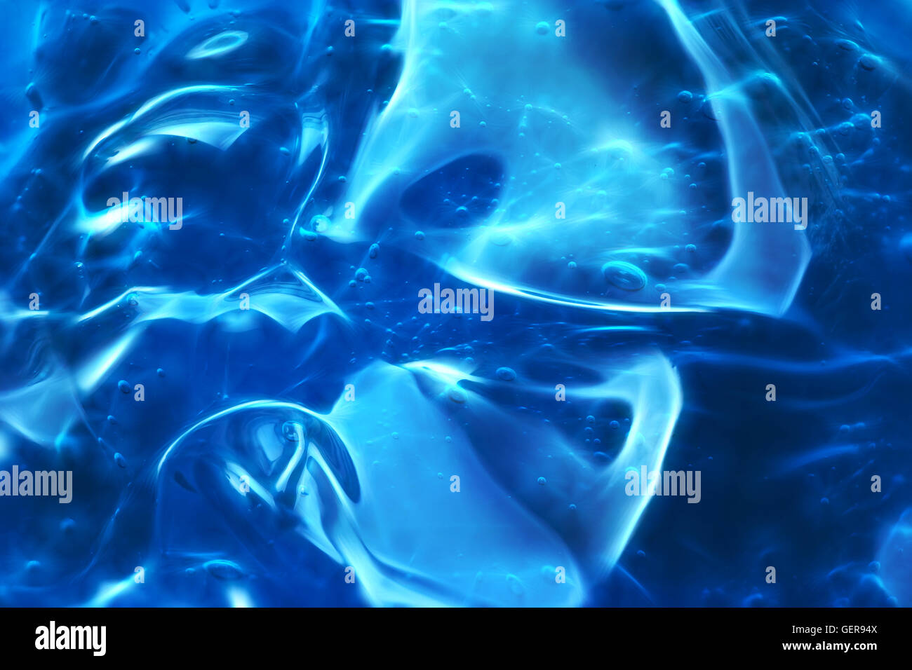 Bubbles in abstract blue gel Stock Photo - Alamy