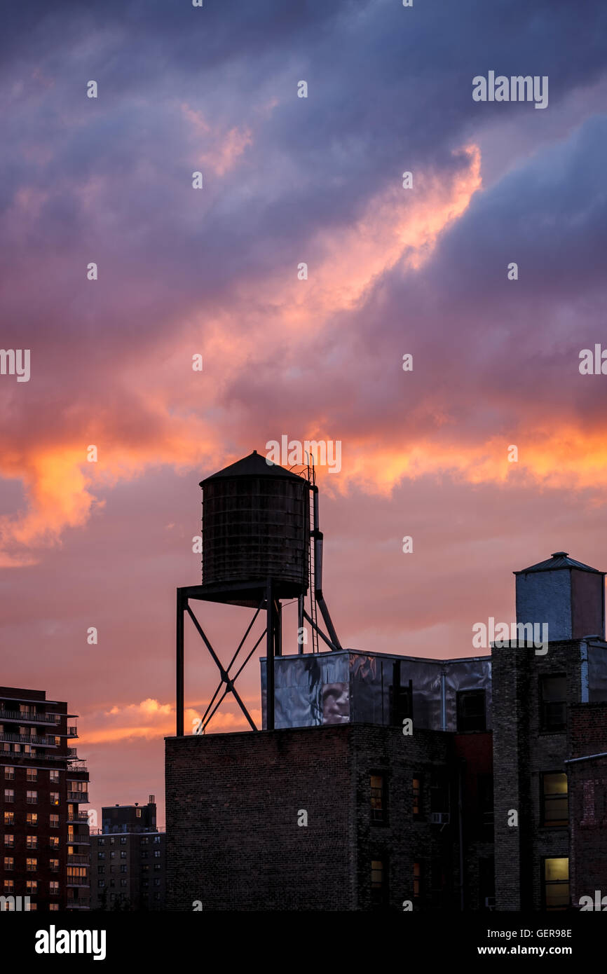 New York City water tower at sunset in Chelsea (Manhattan Stock Photo ...