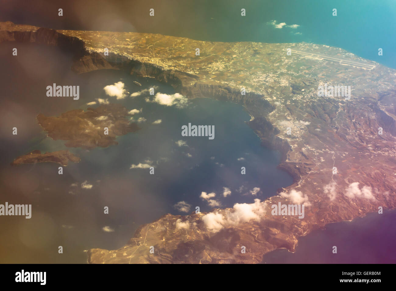 Greek Island Santorini in Aegean sea, aerial view from flight altitude ...