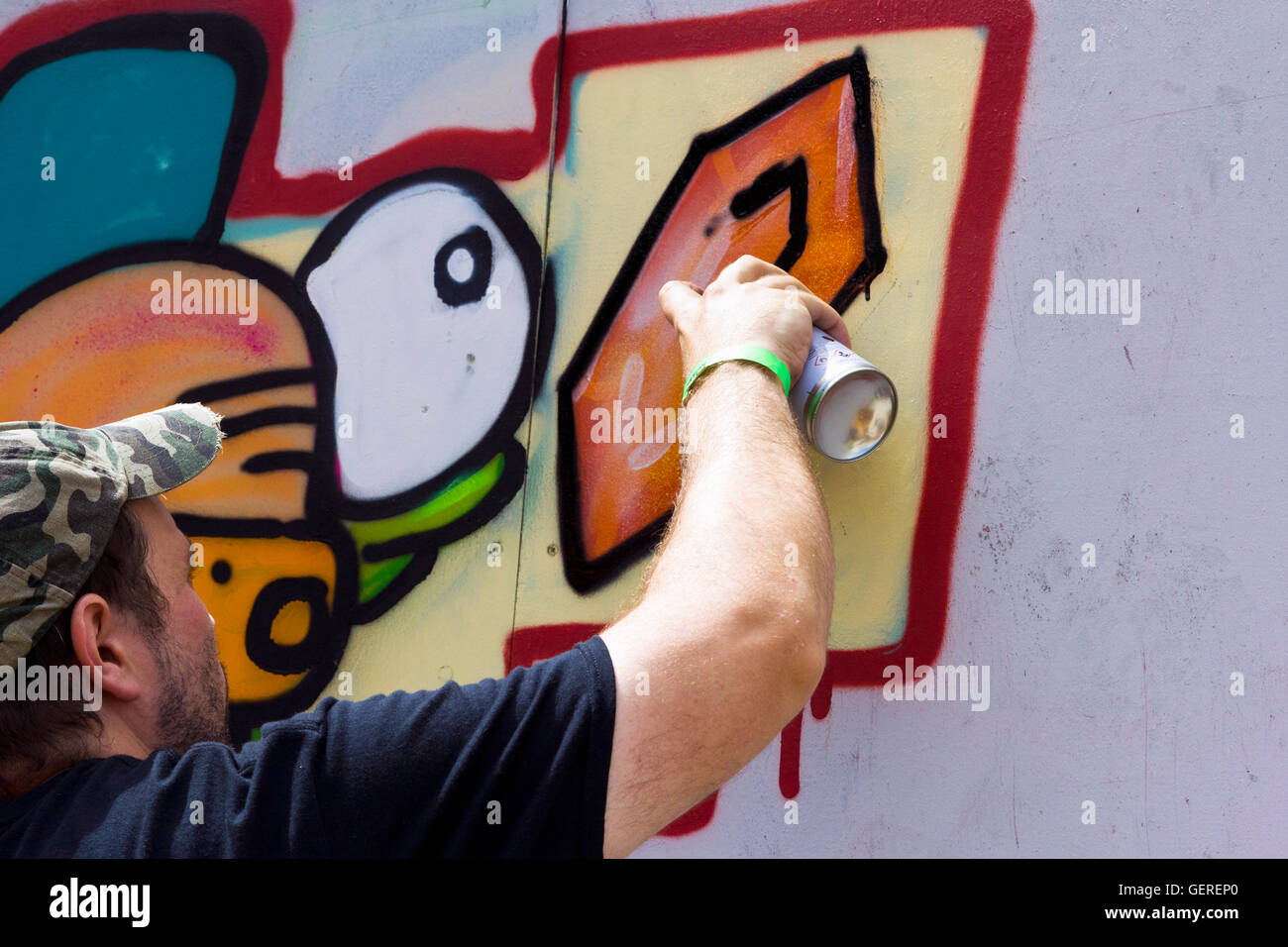 Street artist painting at Upfest (street art festival) in Bedminster ...