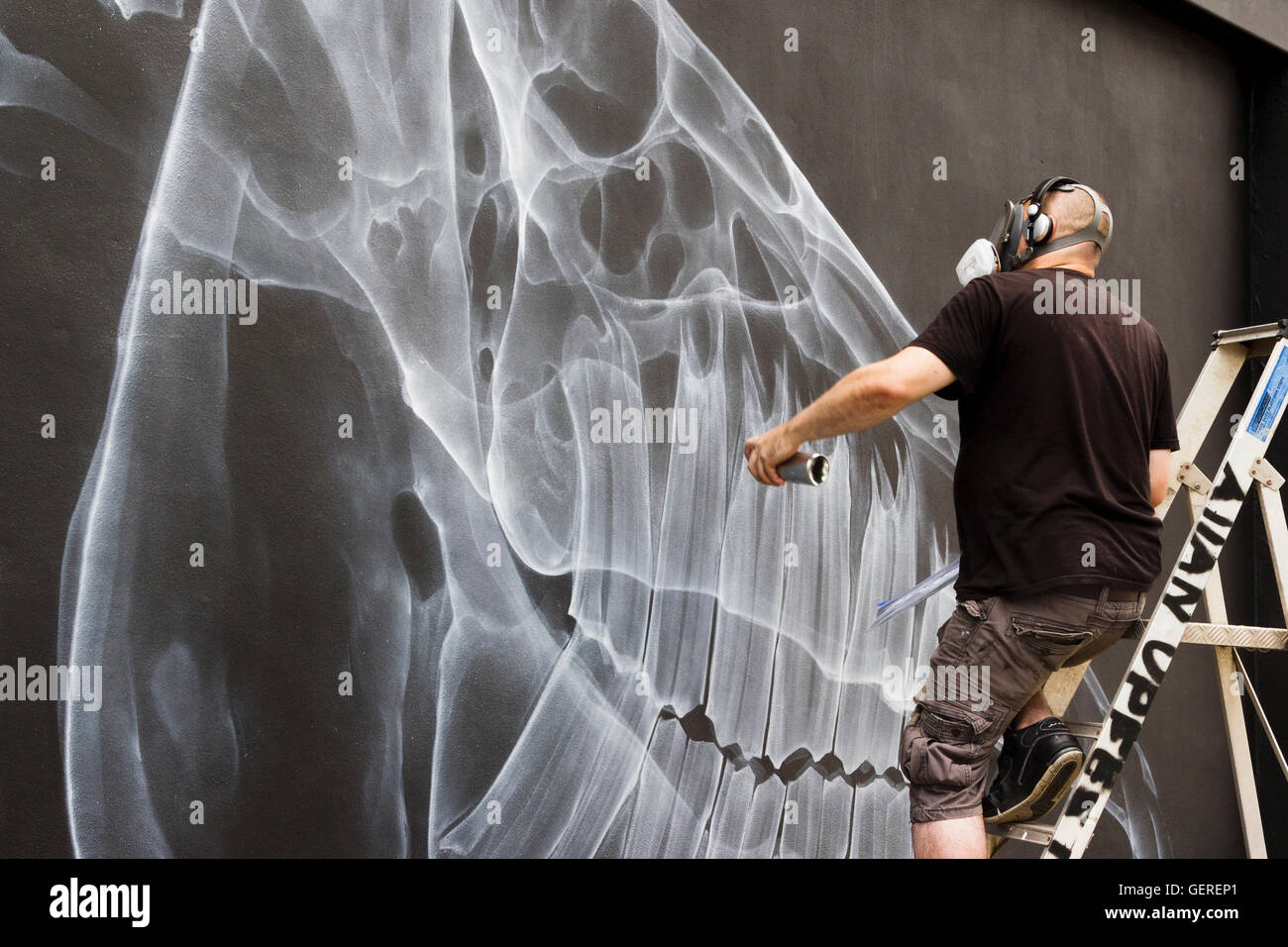 Street artist painting at Upfest (street art festival) in Bedminster ...