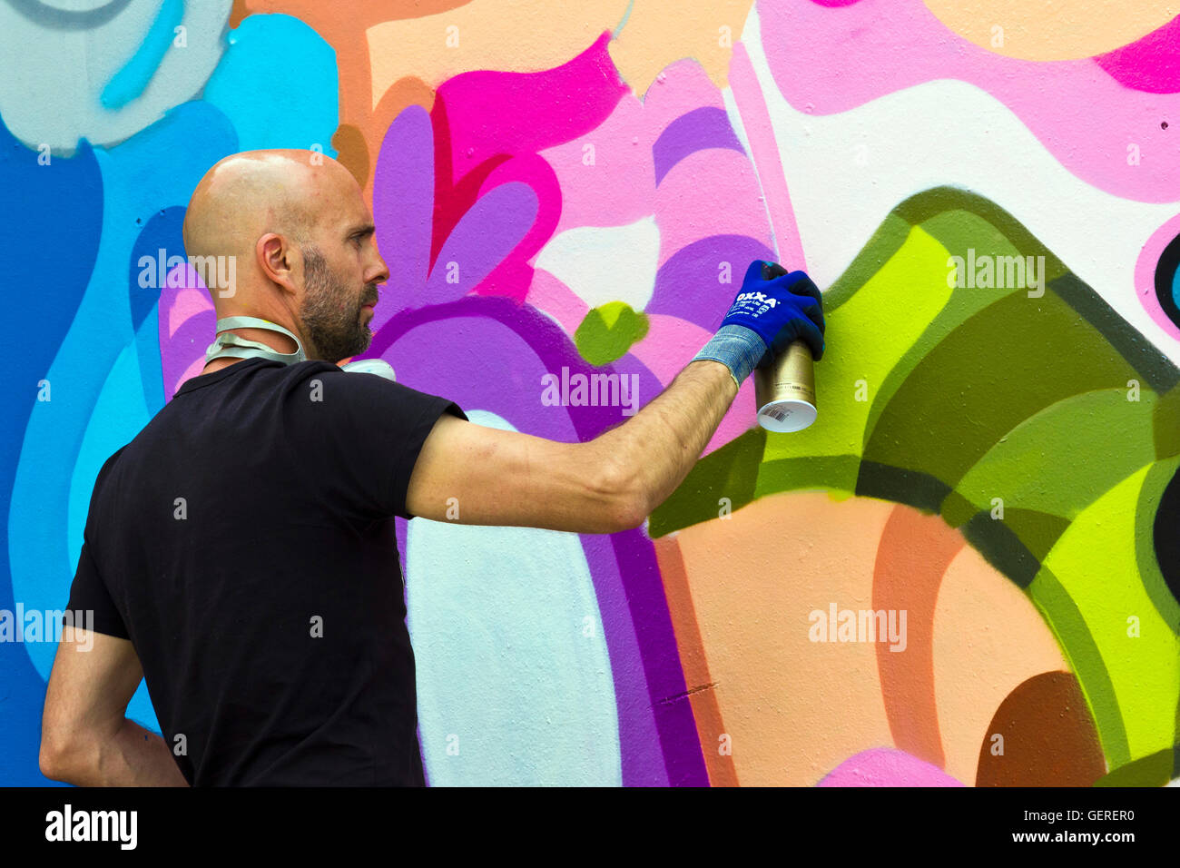 Street artist painting at Upfest (street art festival) near the Tobacco ...