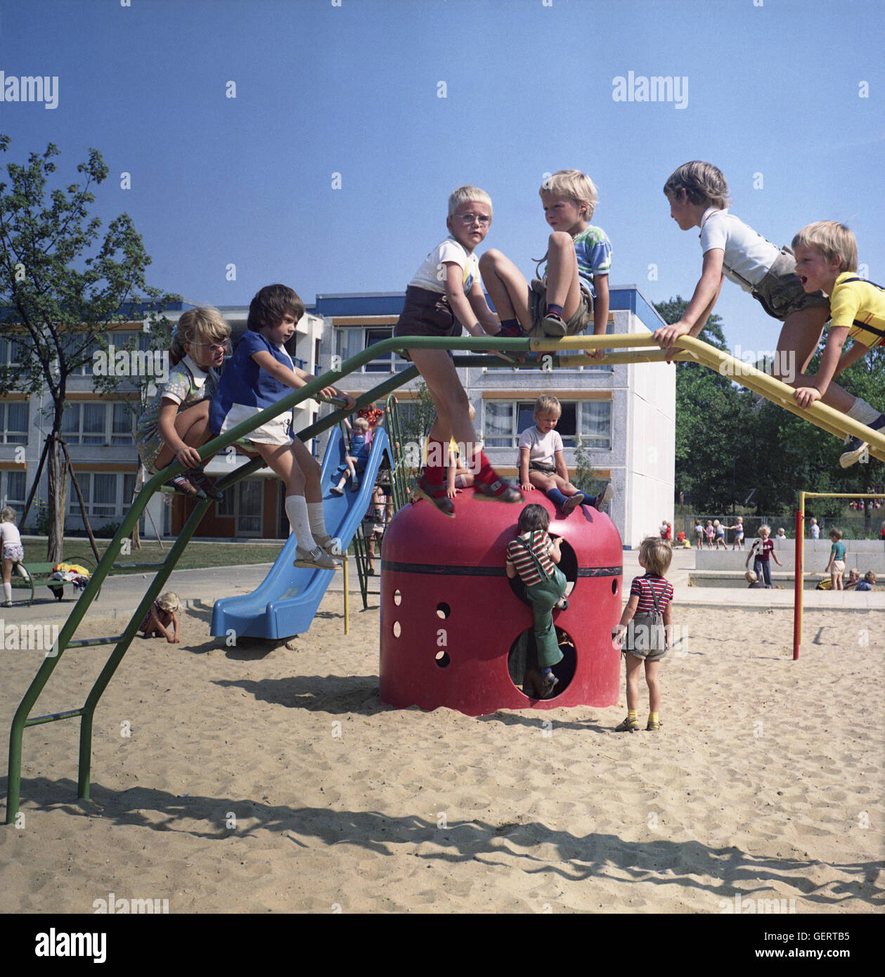 Berlin, GDR, kindergarten Children playing in a playground Stock Photo ...