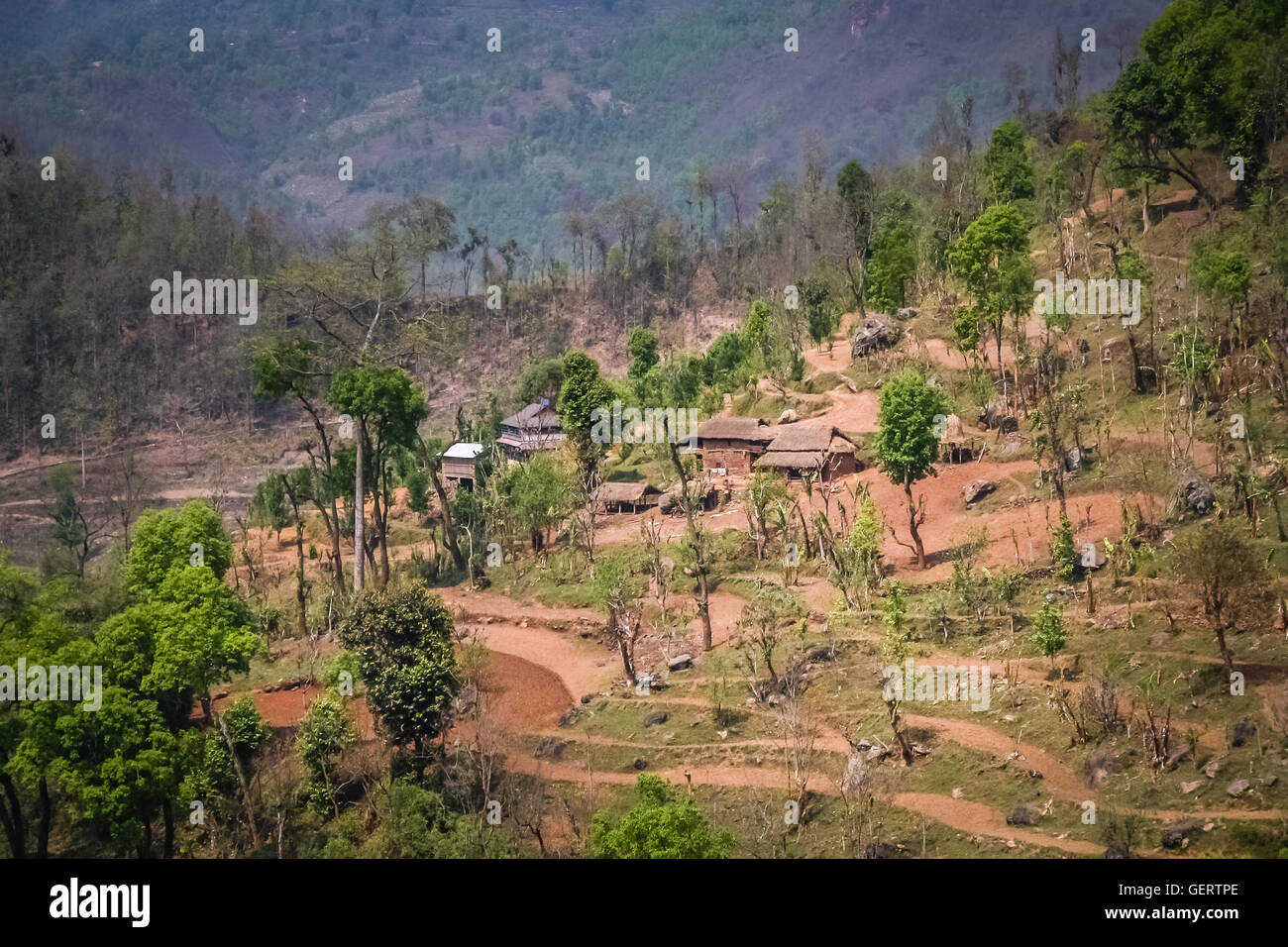 Village huts on the slopes of a mountain in Nepal Stock Photo - Alamy