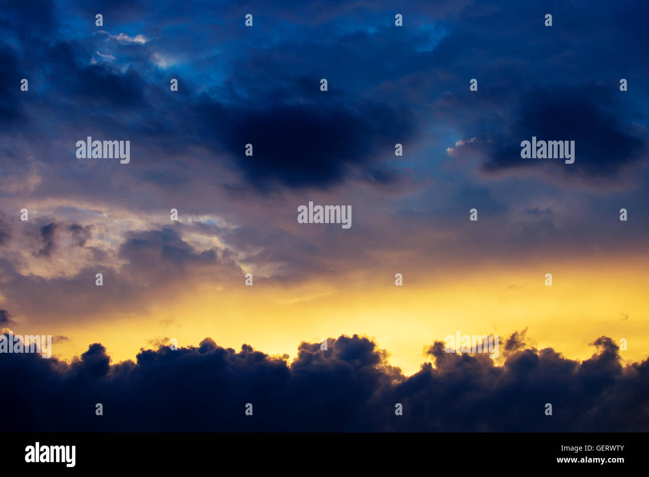 Photo of dramatic sunset with dark clouds Stock Photo - Alamy