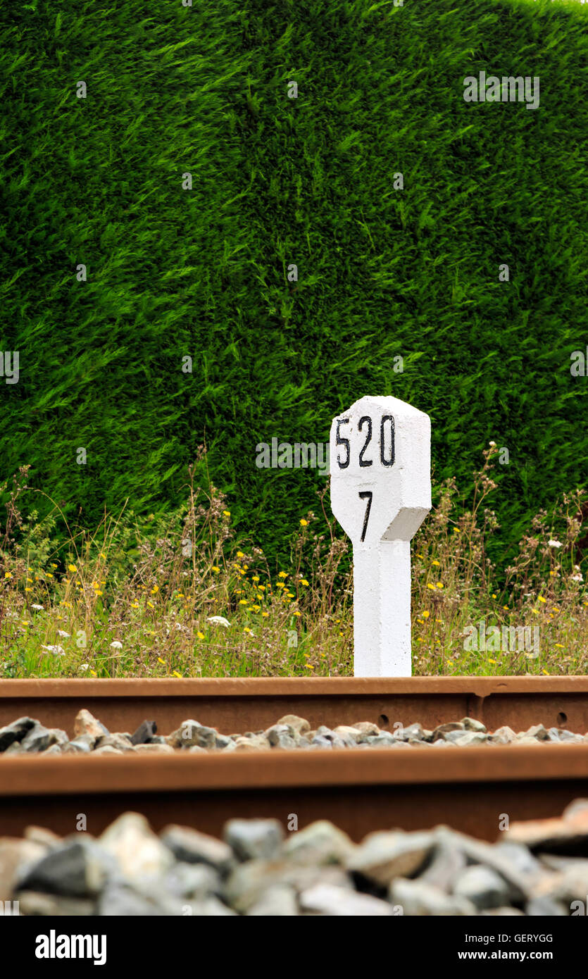 Stone signal in the railway line. Vertical image Stock Photo - Alamy