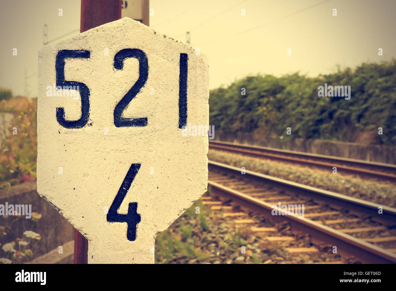 Stone signal in the railway line. Retro vintage style. Horizontal image ...
