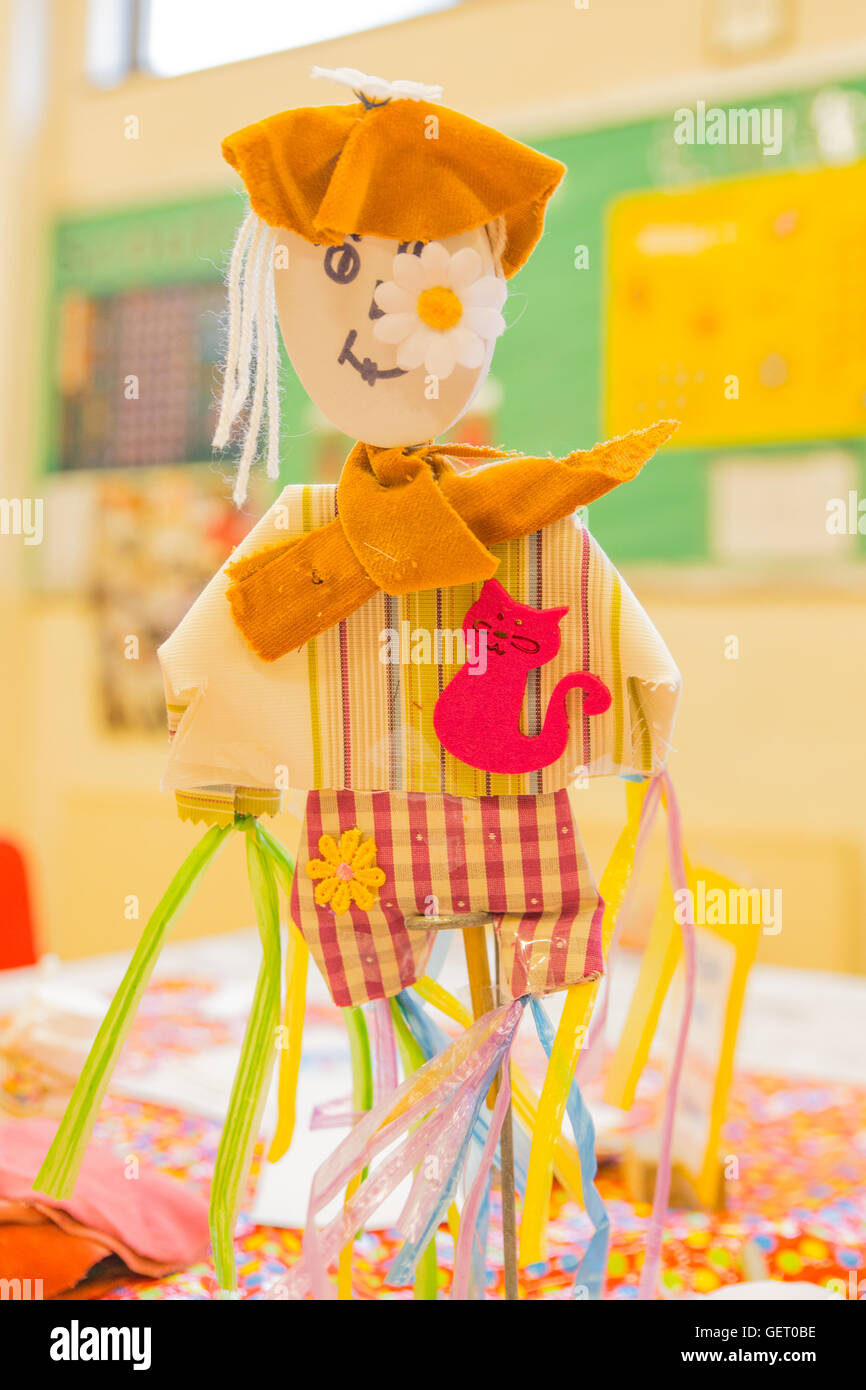 A homemade craft mini-scarecrow made from recycled materials Stock ...