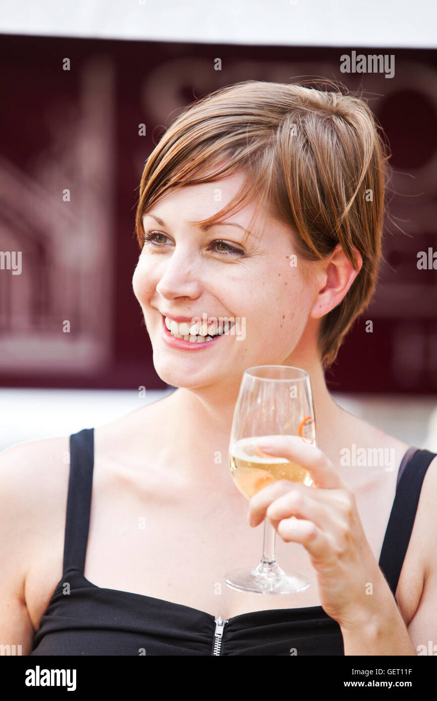 A young lady drinking white wine during the Sydney Wine festival Stock ...