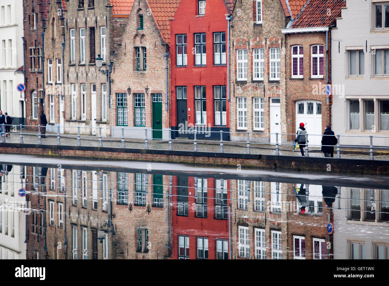 A view of a terrace of traditional houses reflected in the still waters ...