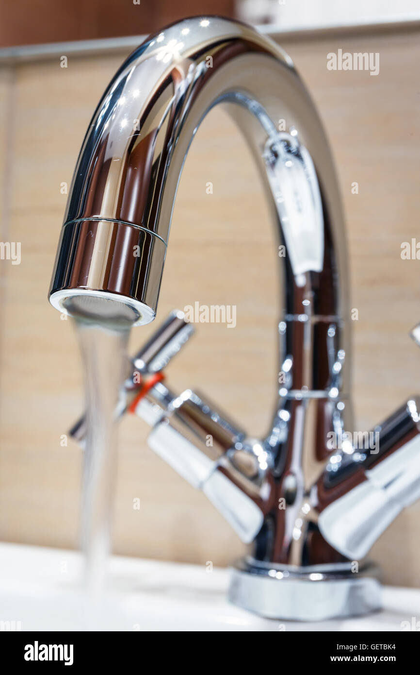 water tap with modern design in bathroom Stock Photo - Alamy