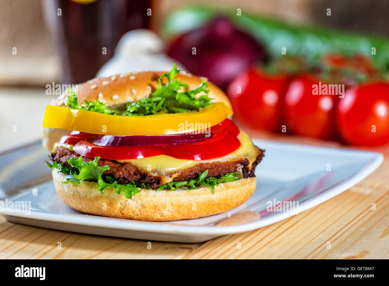 hamburger and drink with slice of lemon Stock Photo - Alamy