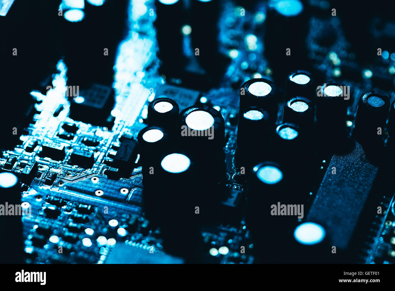 computer motherboard in blue dark background close-up Stock Photo - Alamy