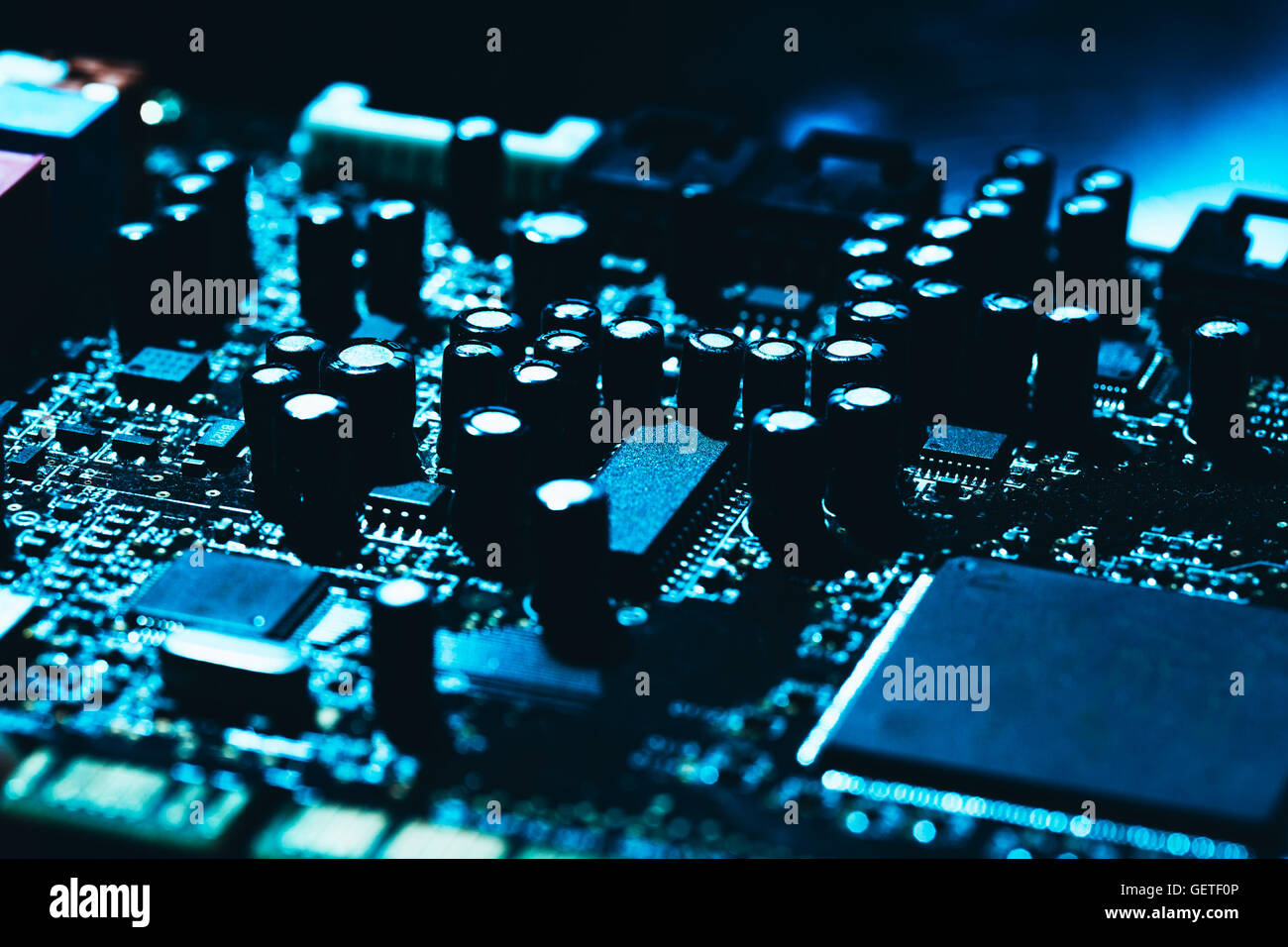 computer motherboard in blue dark background close-up Stock Photo - Alamy