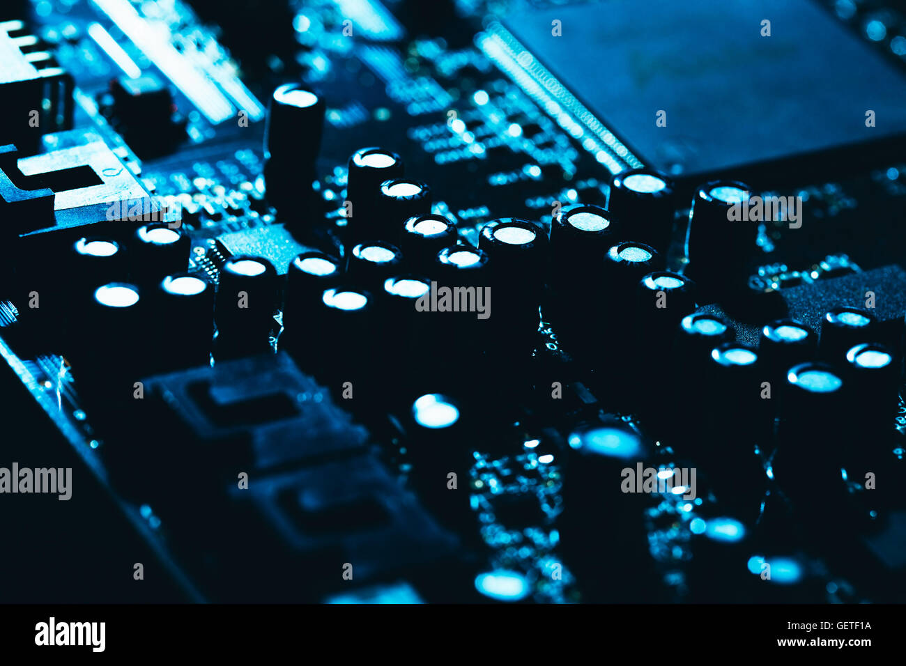computer motherboard in blue dark background close-up Stock Photo - Alamy