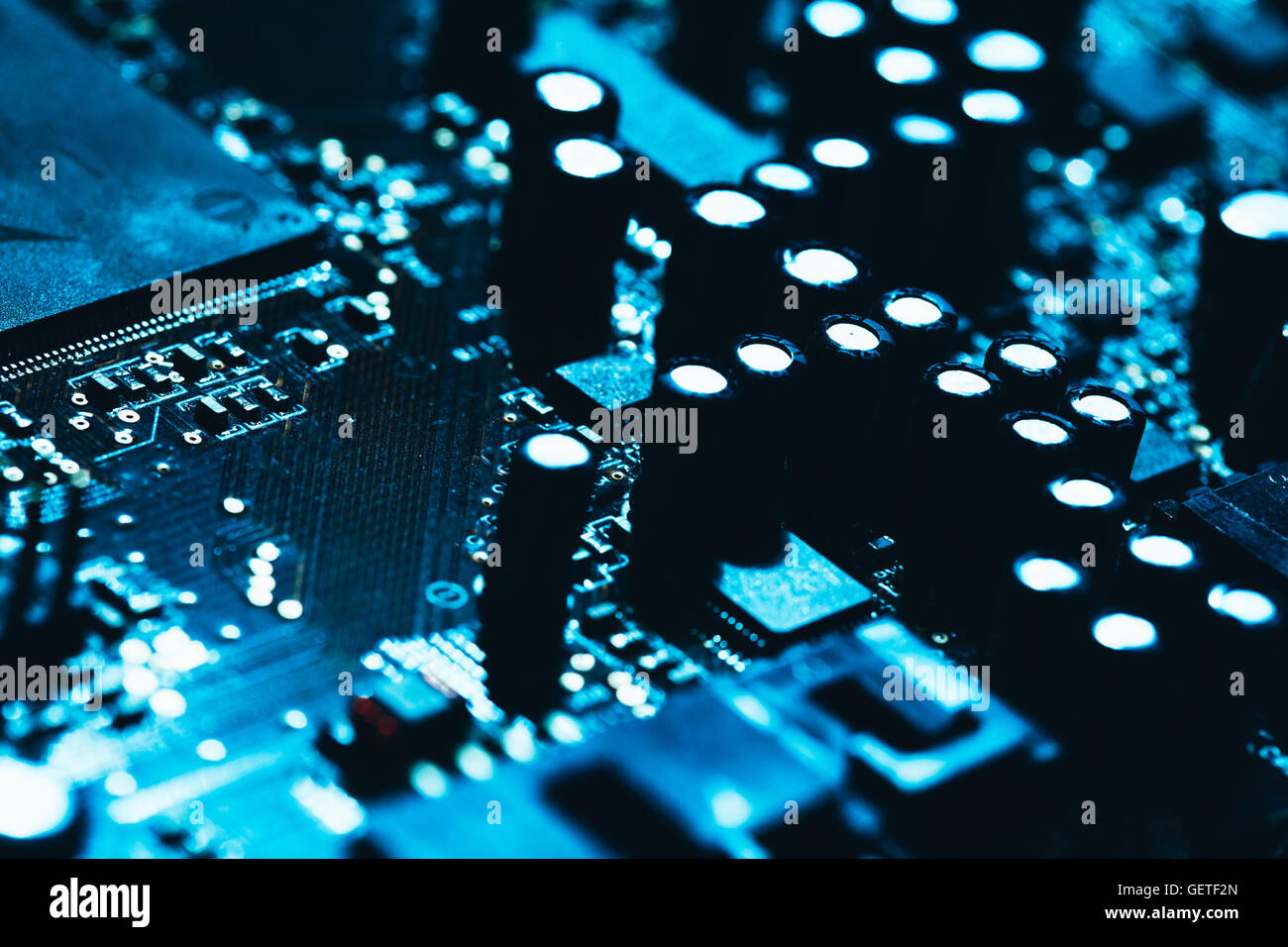 computer motherboard in blue dark background close-up Stock Photo - Alamy