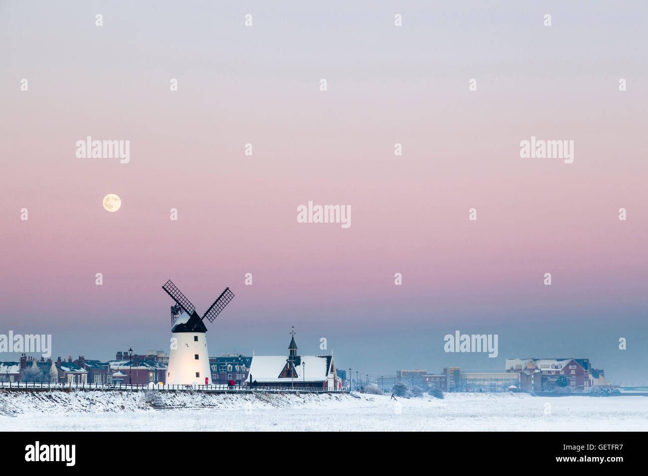 Moonrise over the white windmill at Lytham St Annes in winter Stock ...