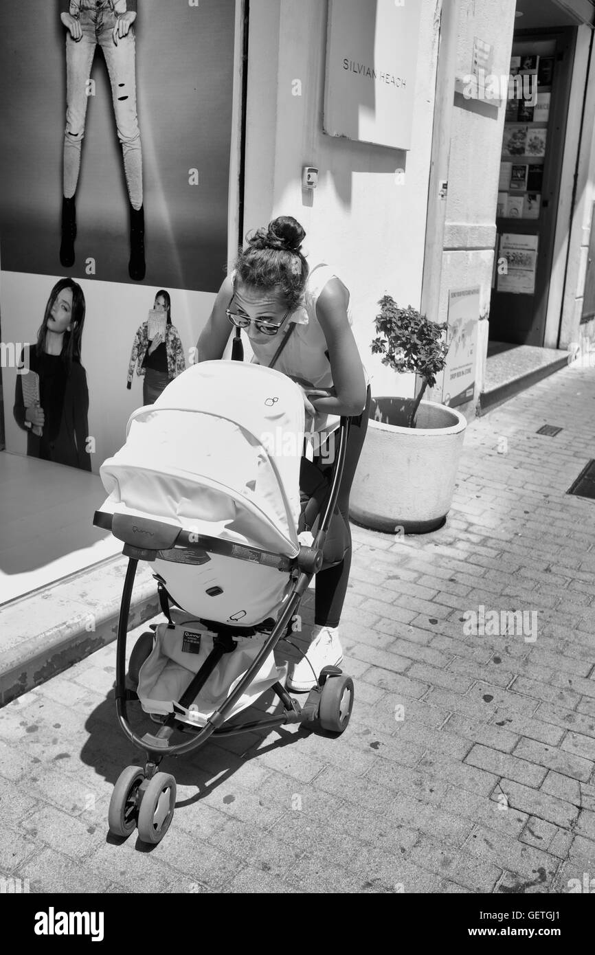 Mother with baby stroller Stock Photo - Alamy
