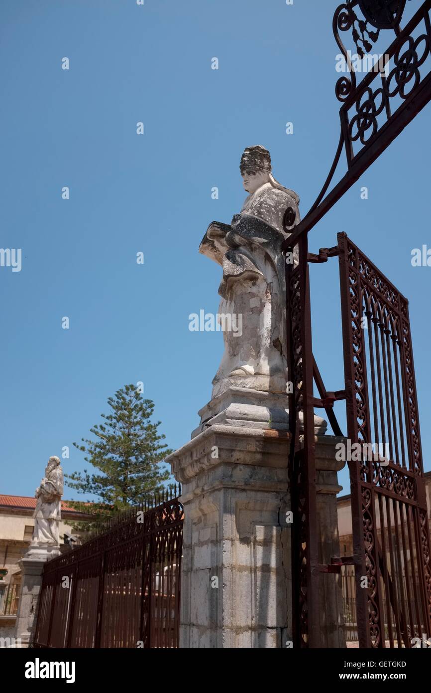 Old stone sculpture on gate Stock Photo - Alamy