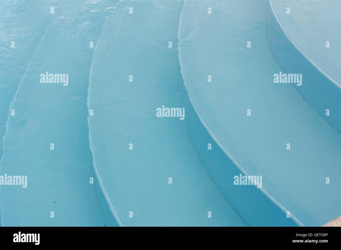 Steps in swimming pool Stock Photo - Alamy