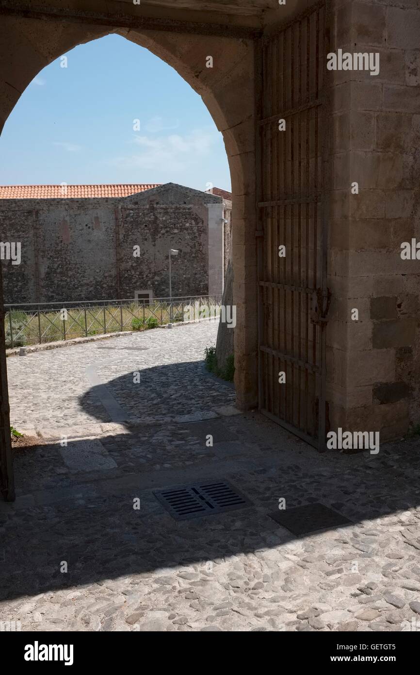 Gate with cobblestone alley Stock Photo - Alamy