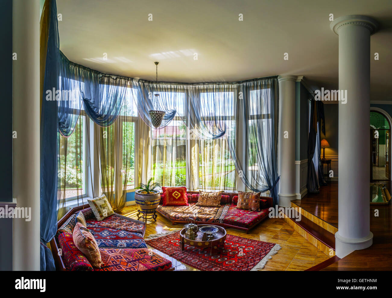 Beautiful living room interior with high windows, old-styled russian ...