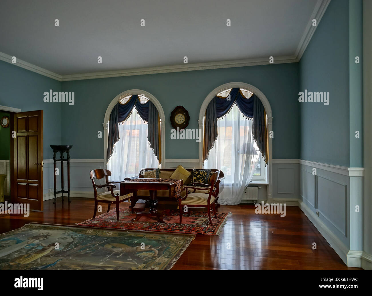 Beautiful living room interior with high windows, old-styled russian ...