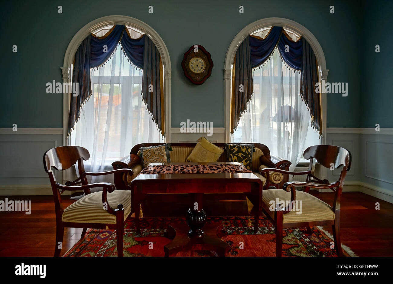 Beautiful living room interior with high windows, old-styled russian ...