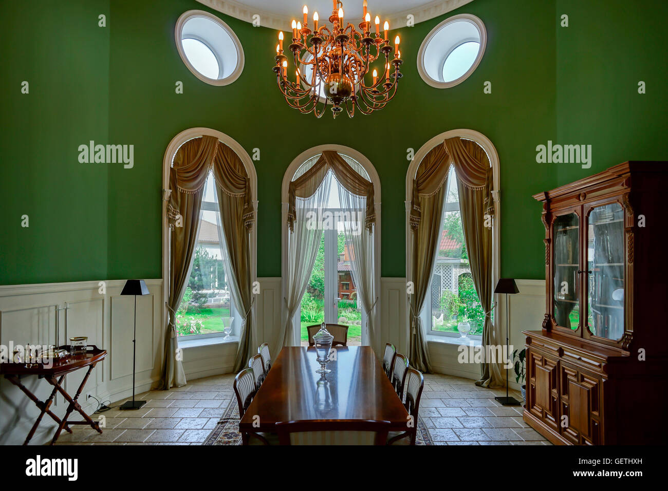 Beautiful living room interior with high windows, old-styled russian ...