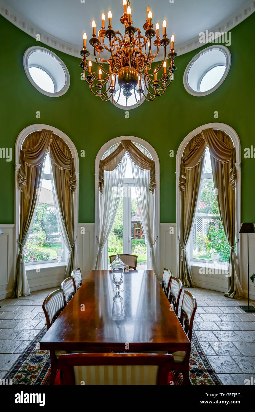 Beautiful living room interior with high windows, old-styled russian ...