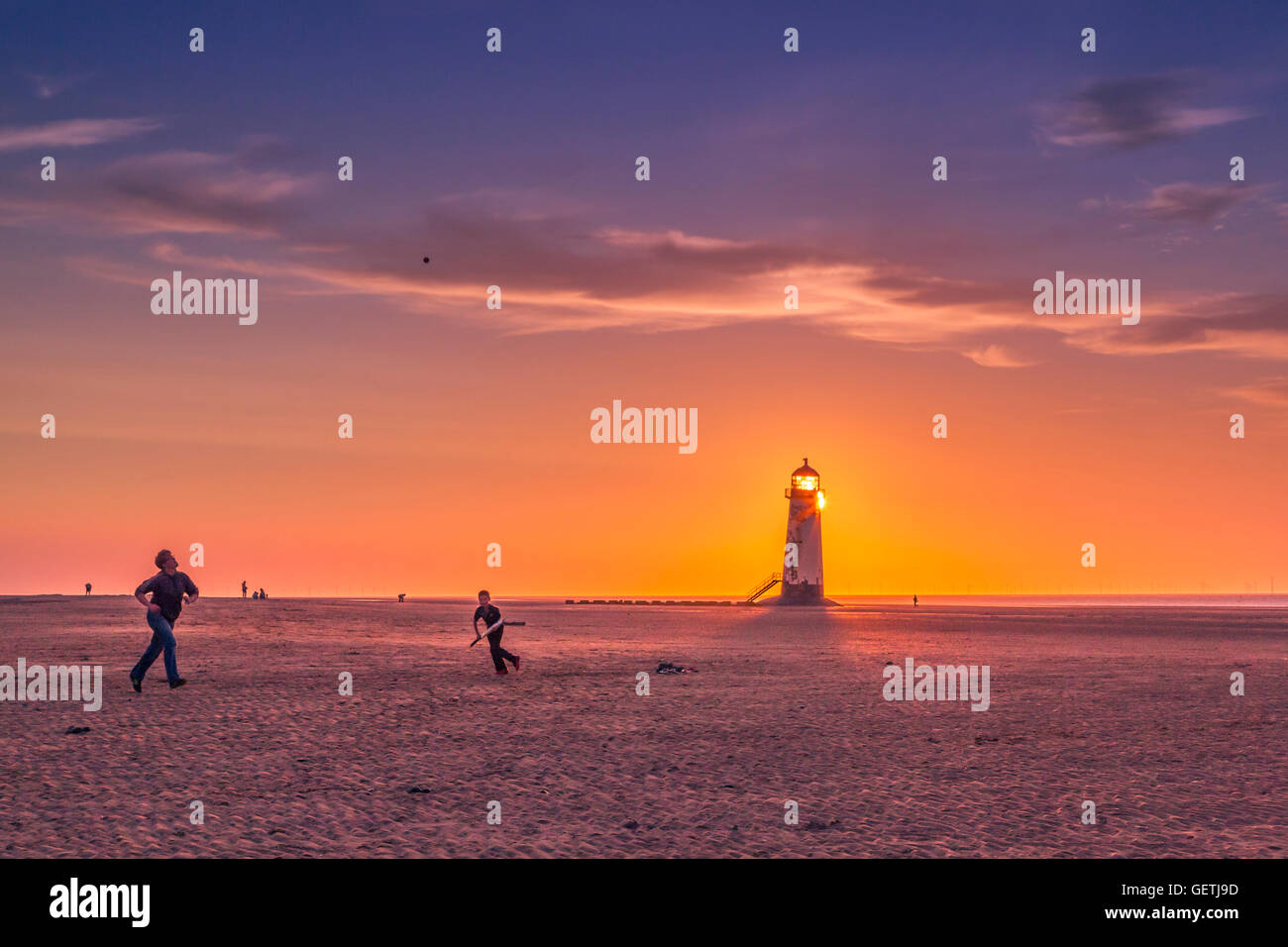 Playing beach cricket on Talacre beach at sunset Stock Photo - Alamy