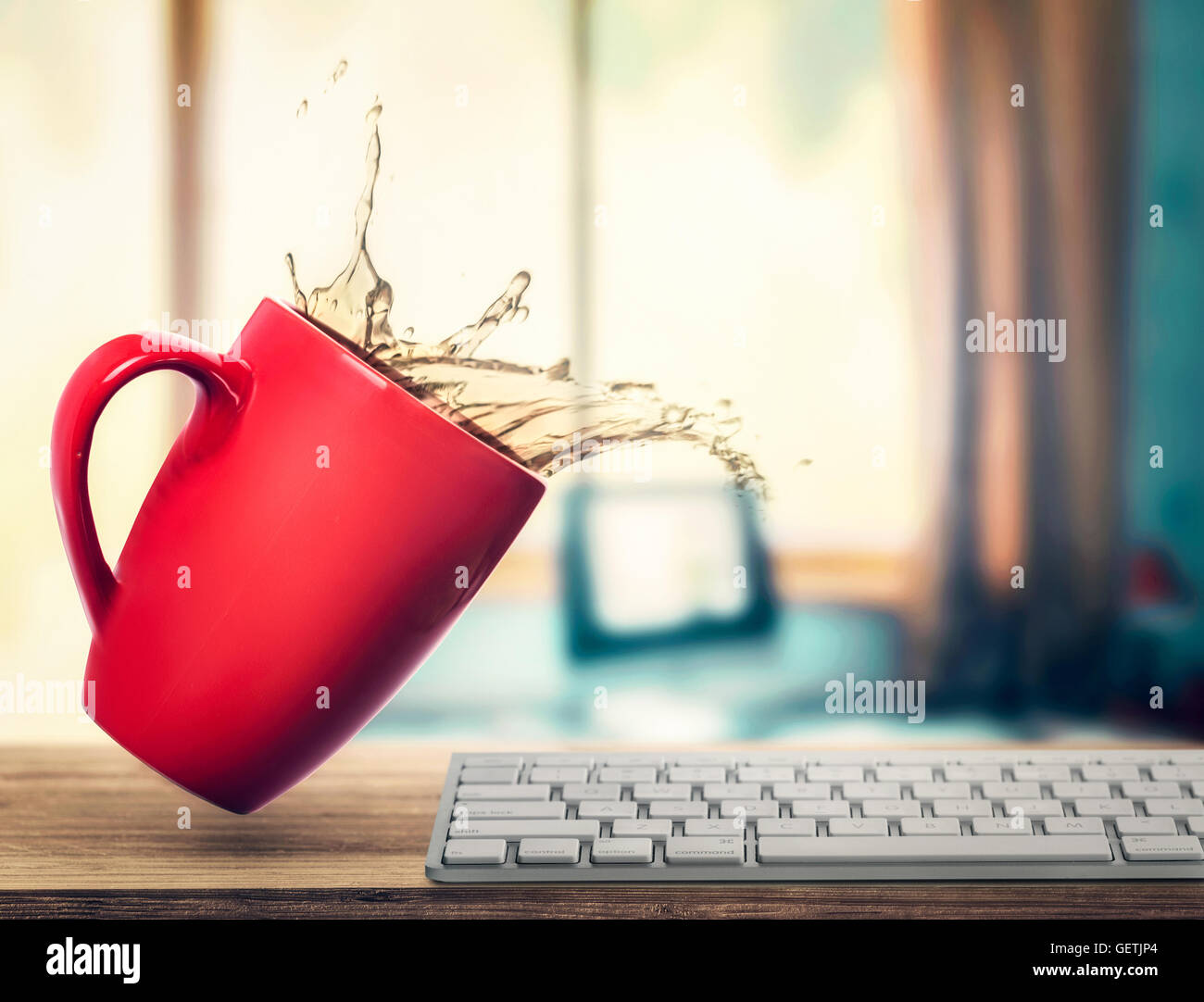 Coffee (tea) spilled on the keyboard Stock Photo - Alamy