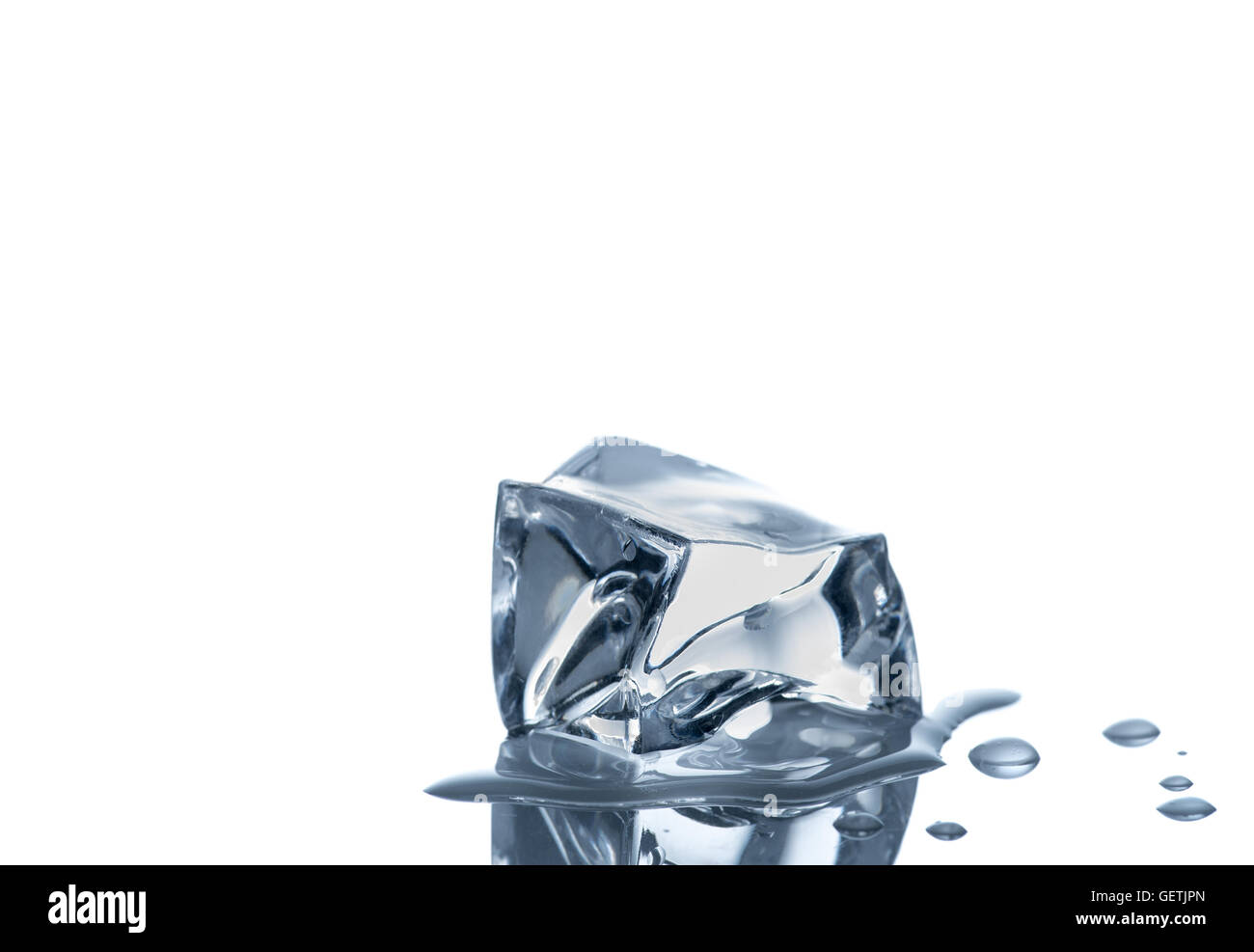 Melting ice cube on white background Stock Photo - Alamy
