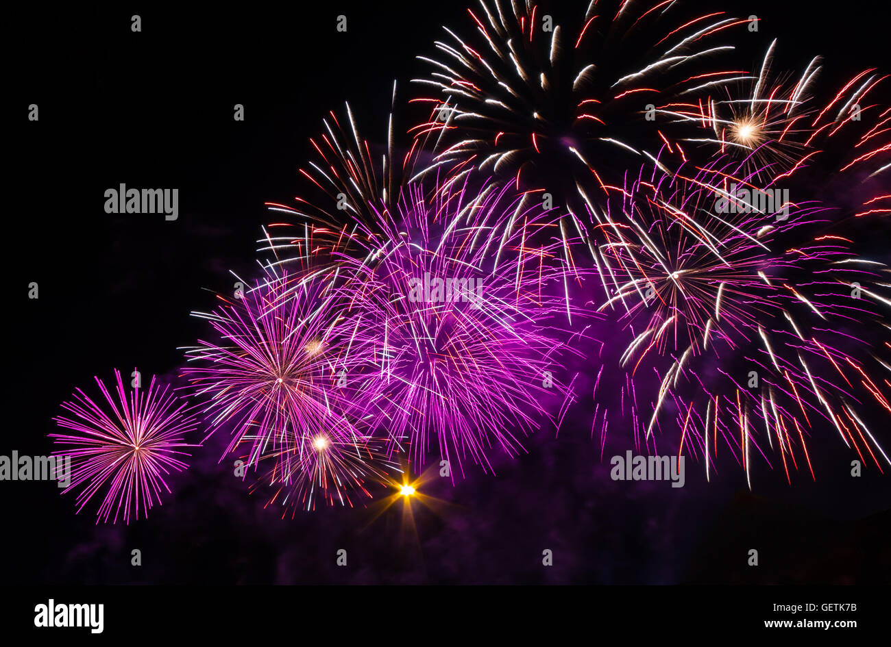 Multiple magenta pink isolated fireworks burst Stock Photo - Alamy