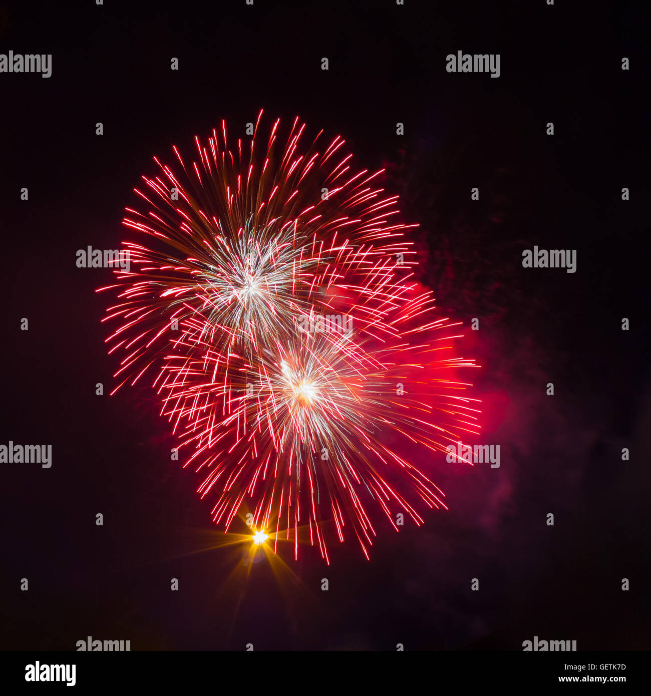Isolated multiple red fireworks burst Stock Photo - Alamy