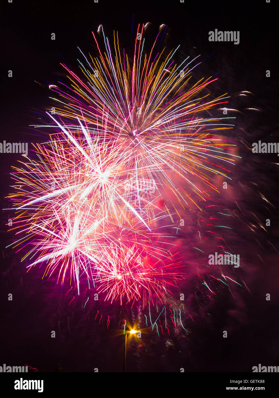 Isolated red multi colored fireworks burst Stock Photo - Alamy