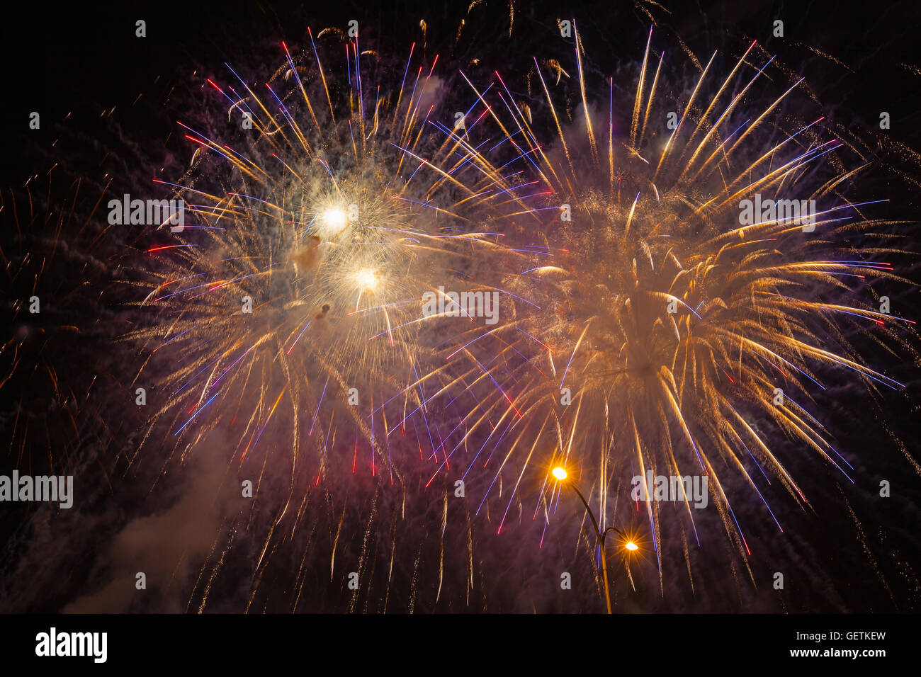 Multiple golden purple fireworks Stock Photo - Alamy