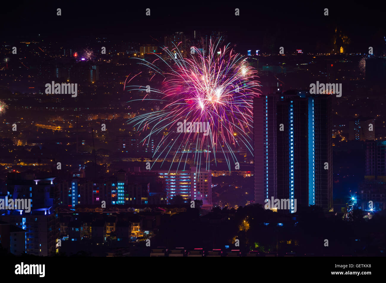 Multiple fireworks burst above buildings and Kepong city, Kuala Lumpur ...