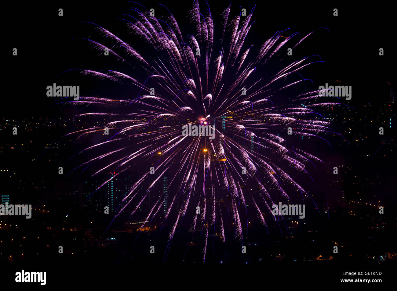 single pink blue fireworks burst Stock Photo - Alamy