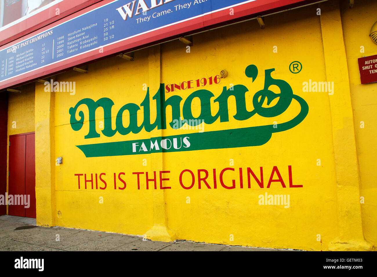 Nathan's Orignial Hot Dog sign on yellow wall Stock Photo - Alamy